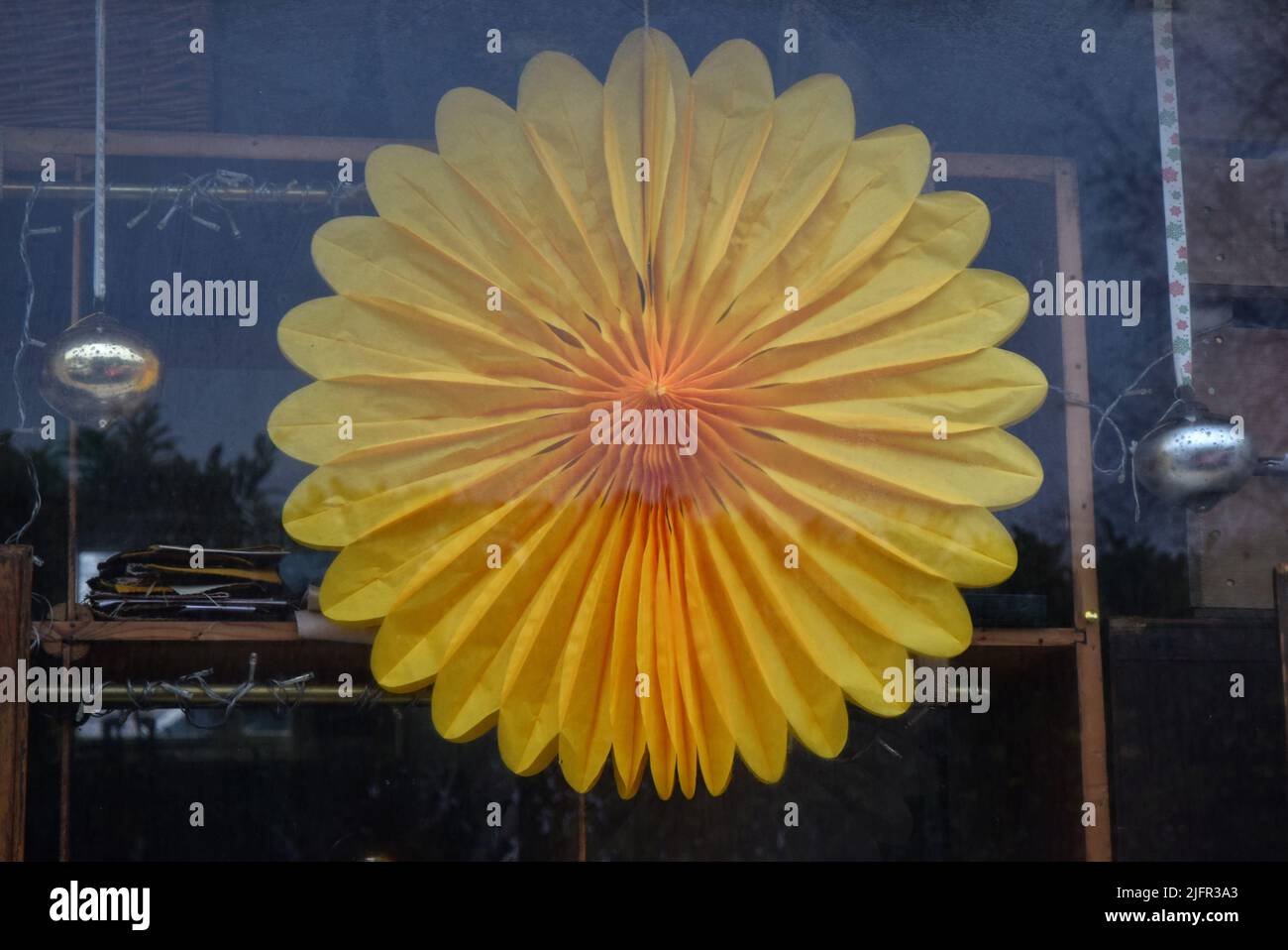 yellow christmas paper decoration in shop window Stock Photo - Alamy