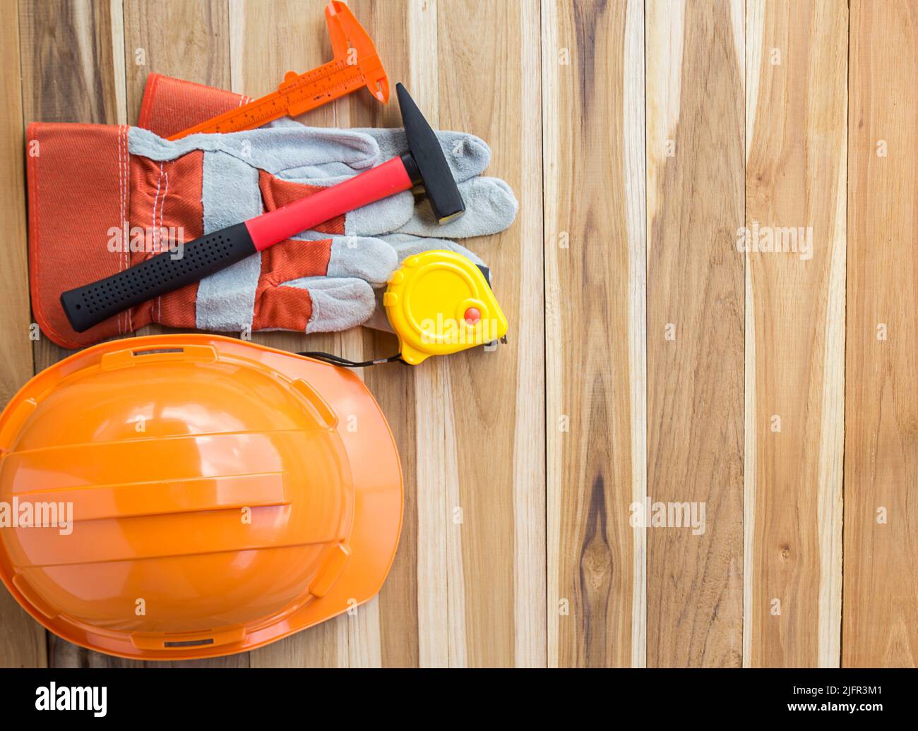Safety equipment and tool kit on wooden table background with copy ...
