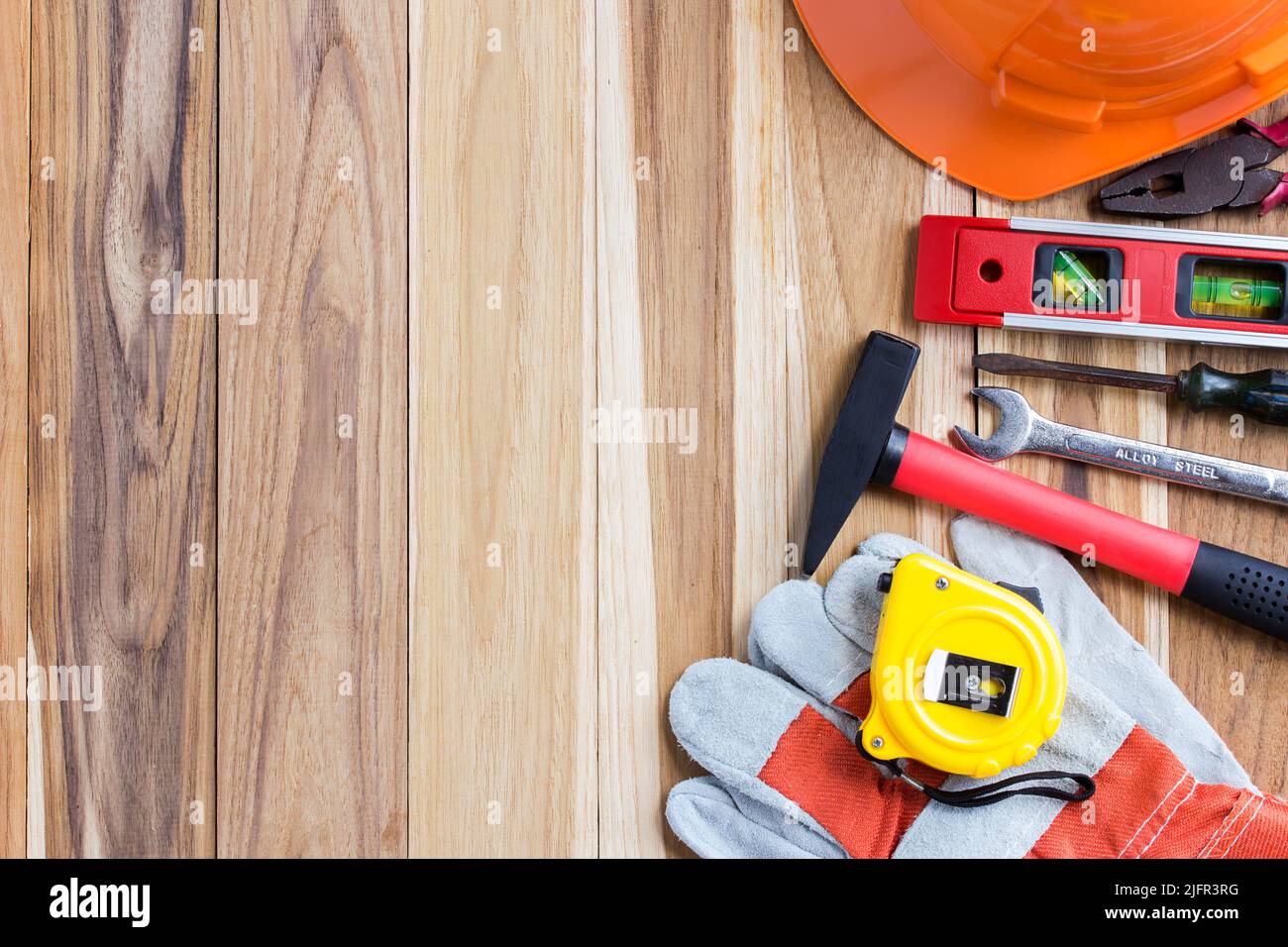 Safety equipment and tool kit on wooden table background with copy ...