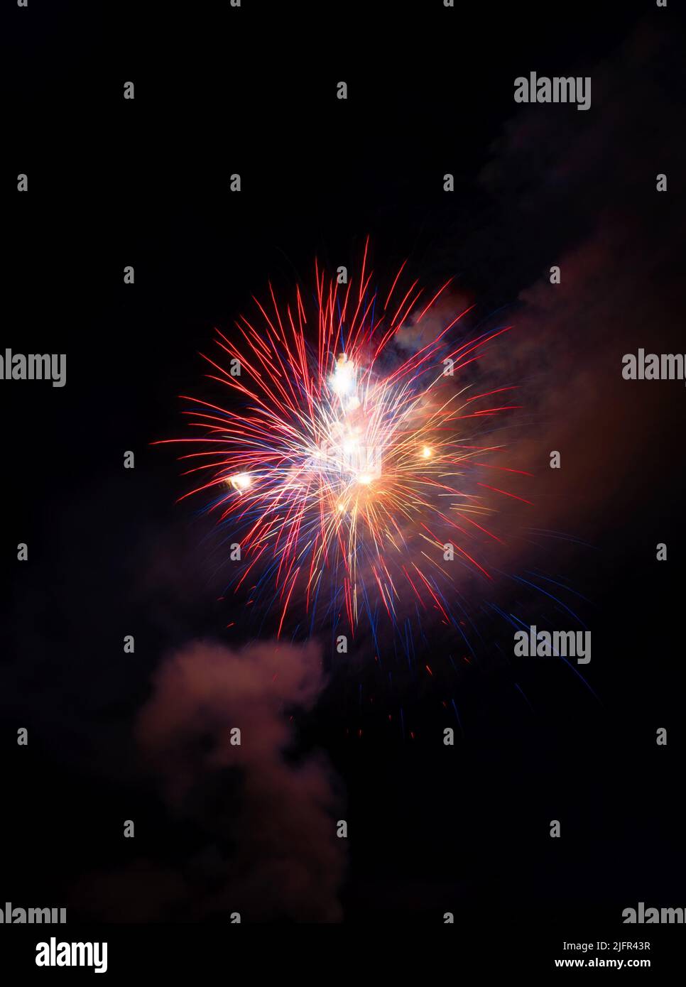 A vertical shot of colorful fireworks at the night sky perfect for ...