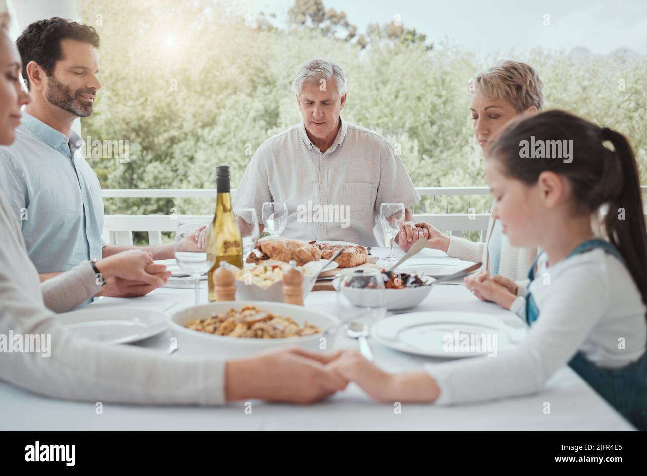 All great change begins at the dinner table. Shot of a beautiful family ...