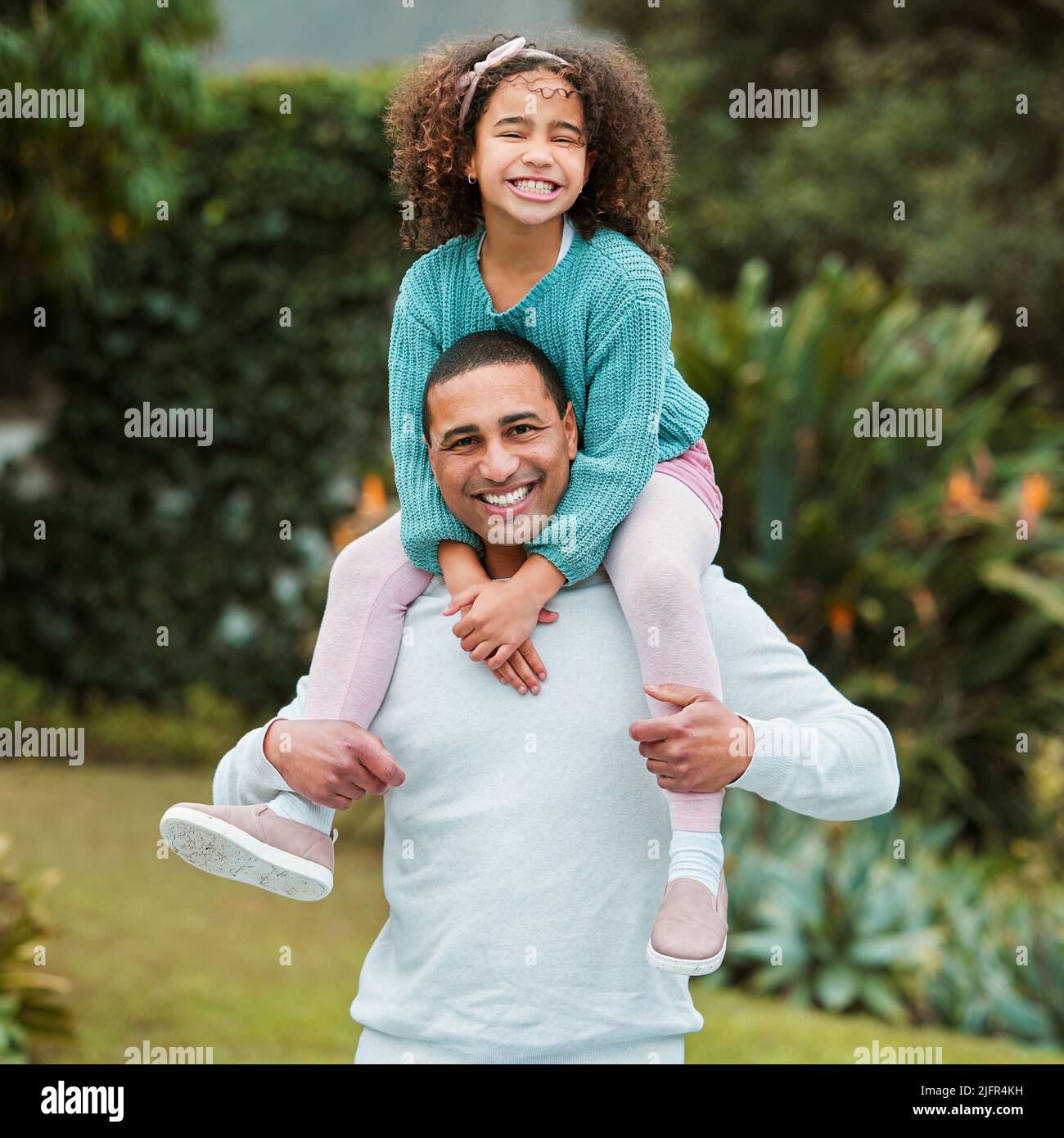 My daughter is my first priority. Shot of a man carrying his daughter ...