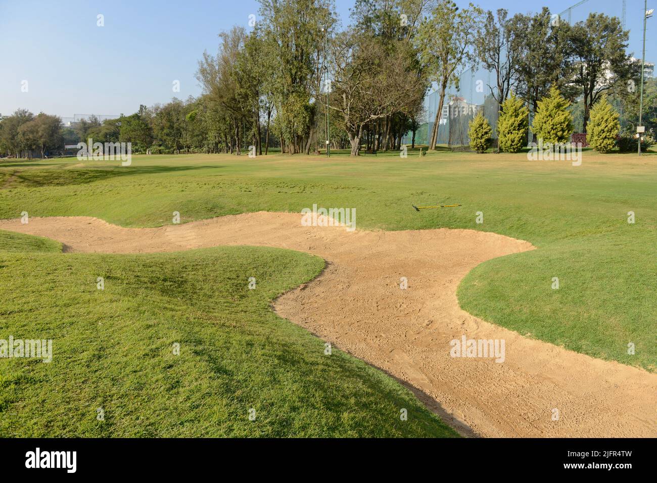 A sand bunker in a golf course on a clear day Stock Photo - Alamy