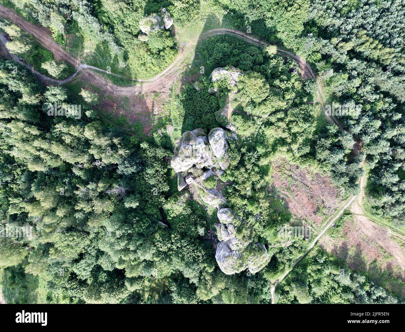 An aerial view of a hole in the rock and mountain landscape Stock Photo ...