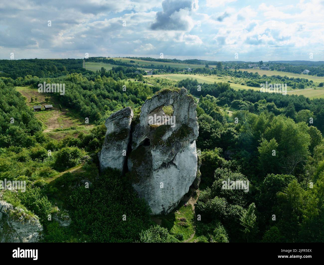 An aerial view of a hole in the rock and mountain landscape Stock Photo ...