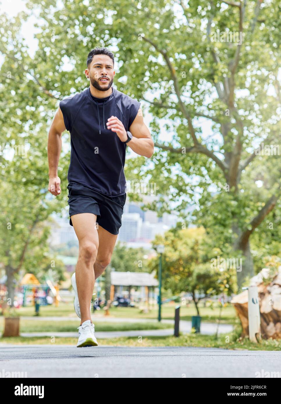 Boost your day with a morning jog. Shot of a sporty young man running ...