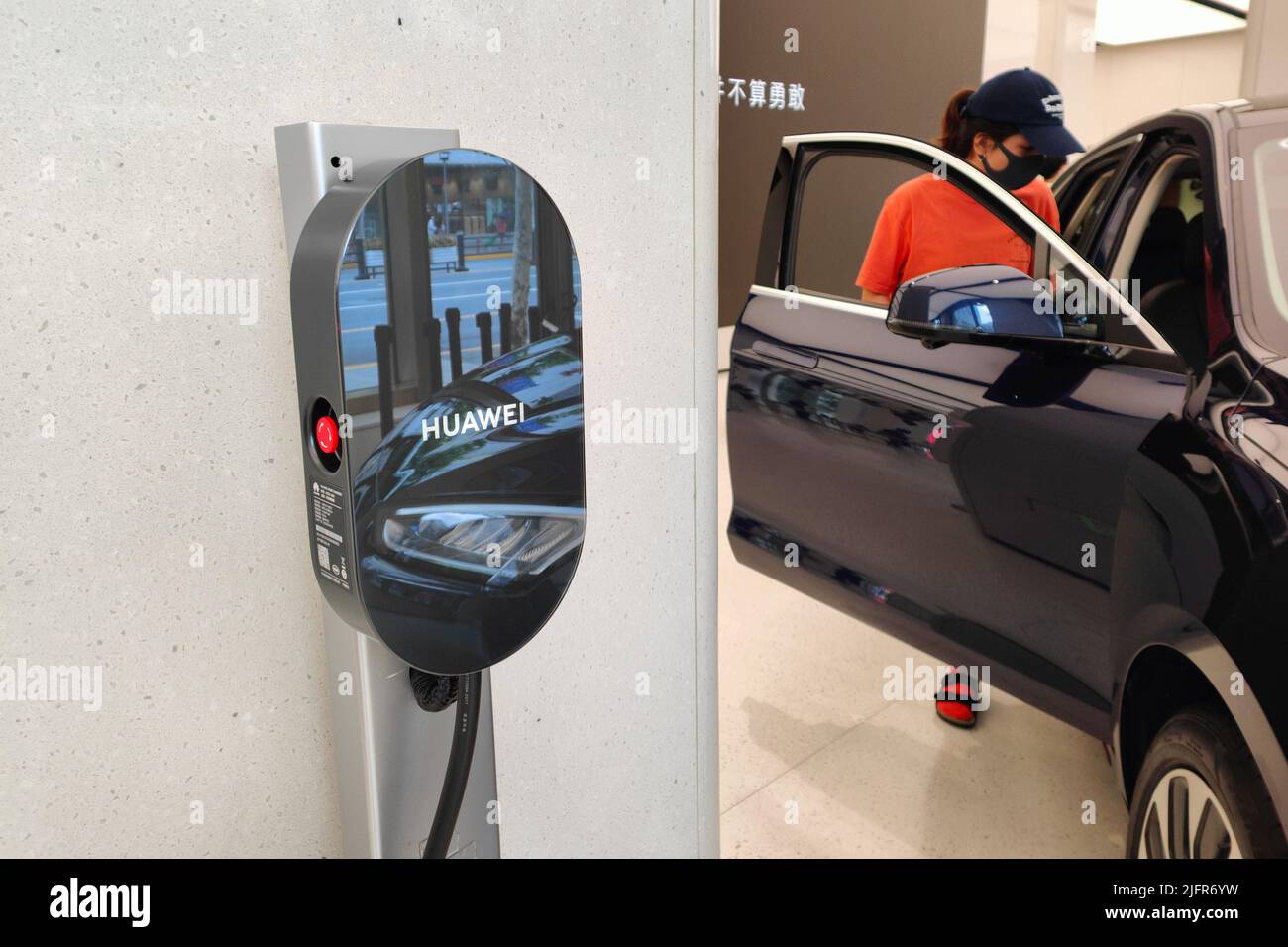 Customers check out huawei's newly released AITO M7 model at huawei's ...