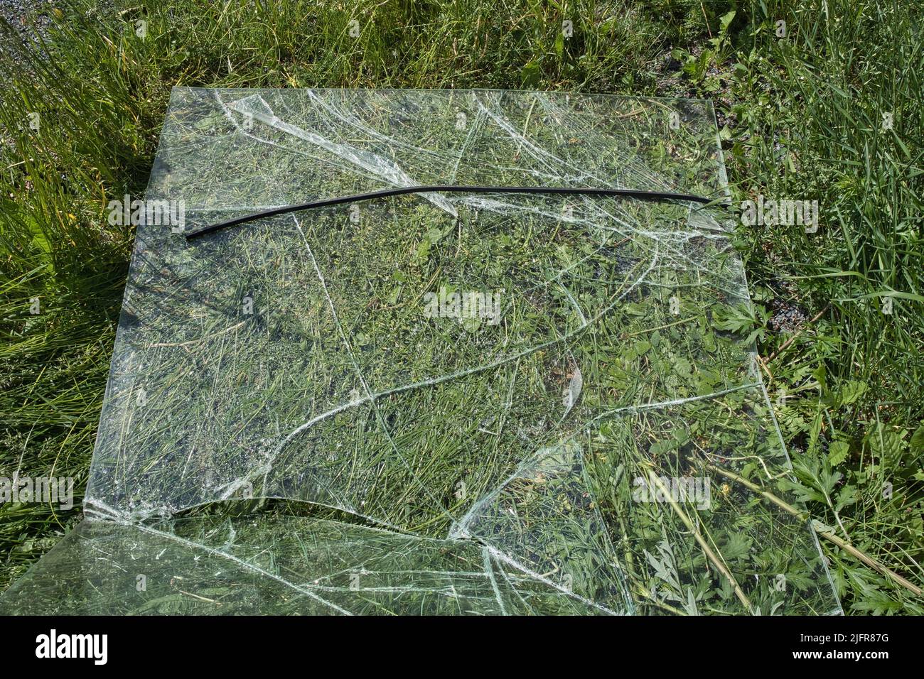 broken glass at a train station platform shelter Stock Photo - Alamy