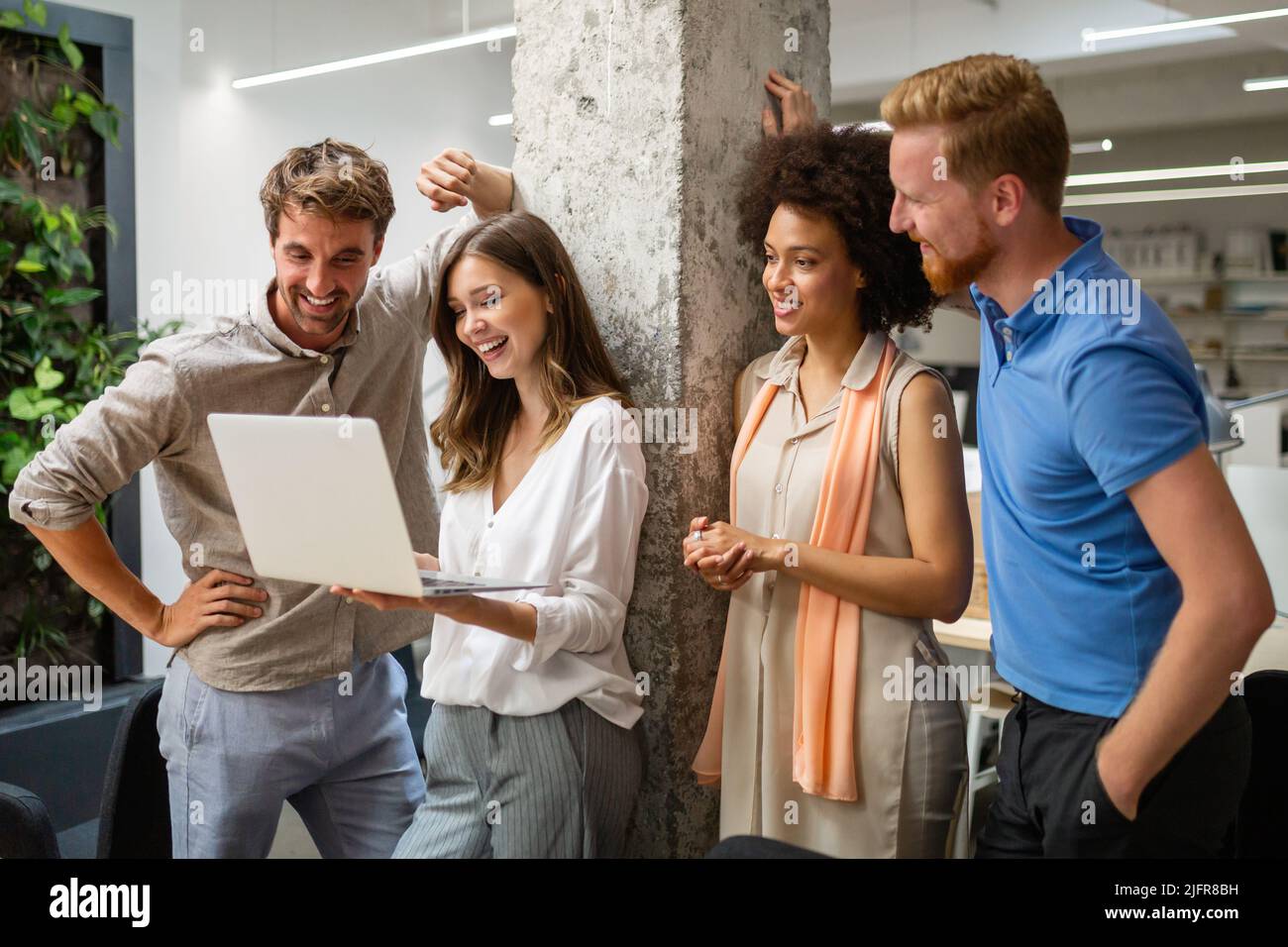 Group of happy multiethnic business people having fun and chatting at ...