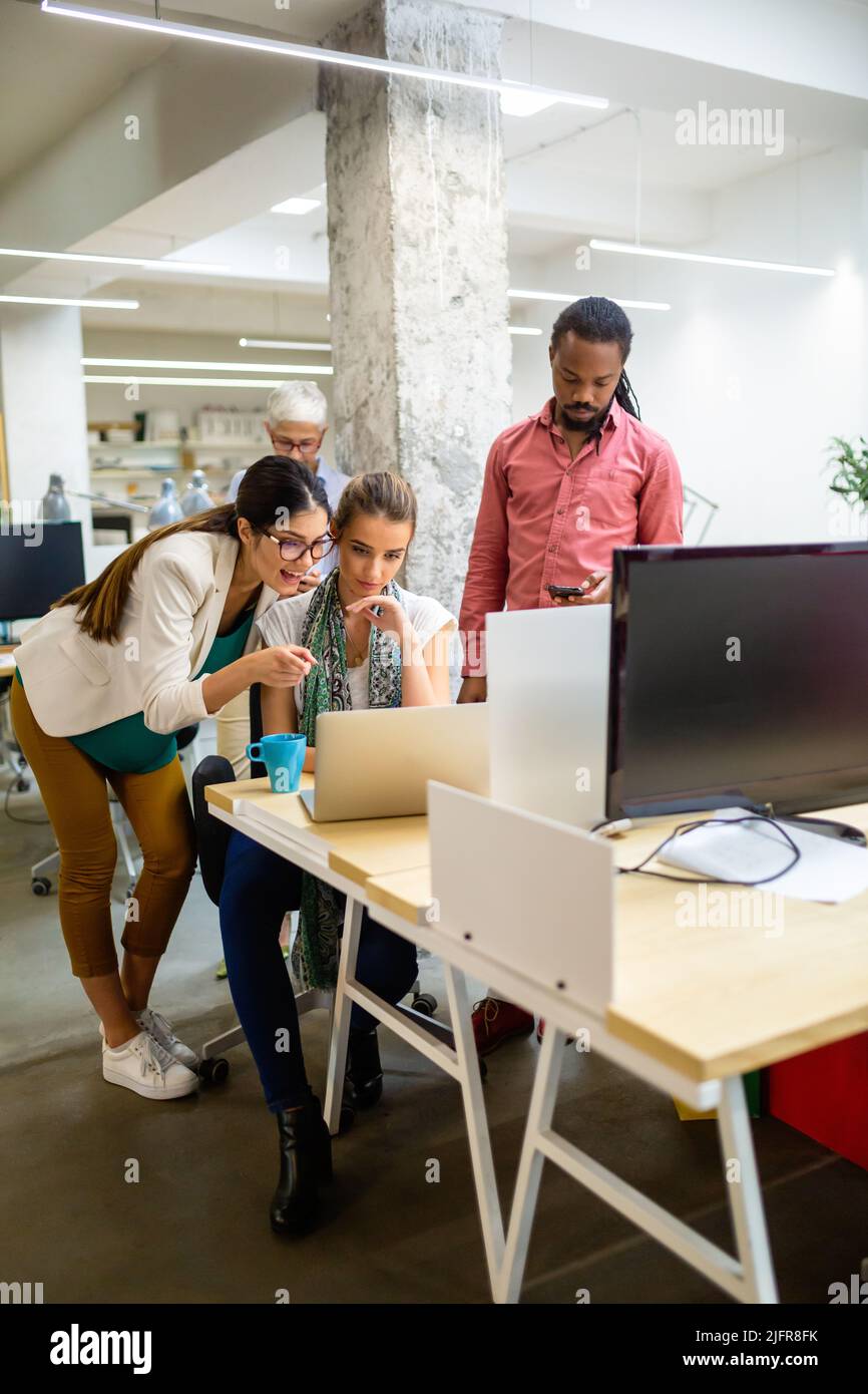 Group of happy multiethnic business people having fun and chatting at ...