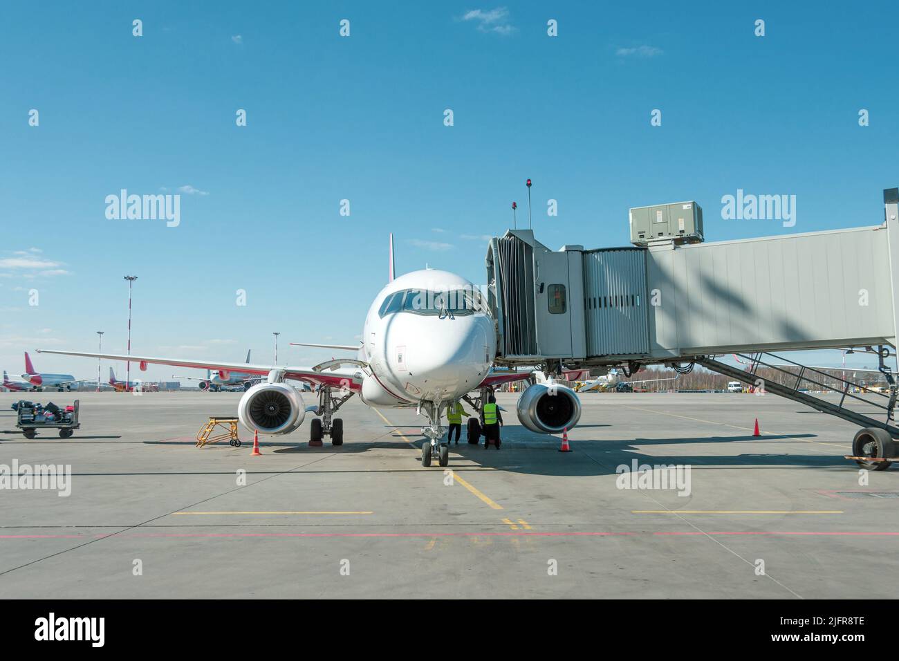 Airplane at the passenger boarding bridge on the runway hi-res stock ...