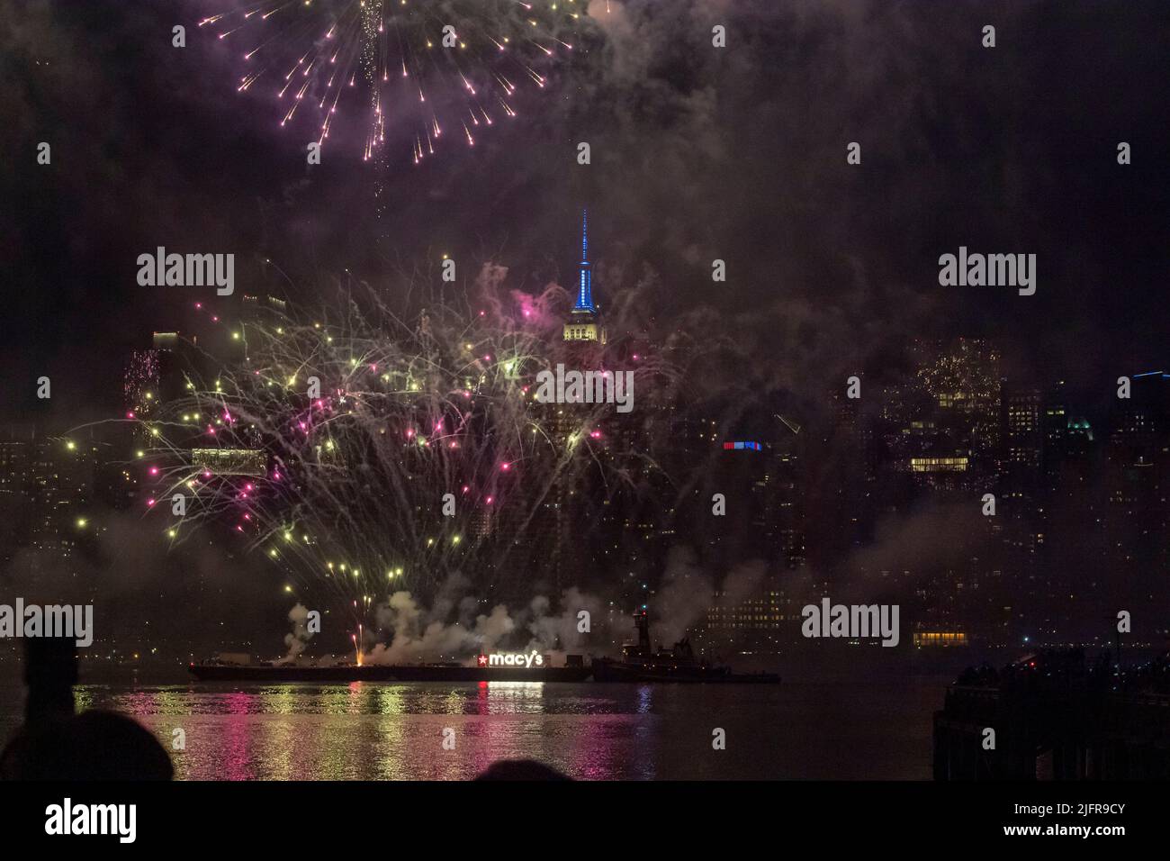 NEW YORK, NY - JULY 04: Fireworks explode over the east river during ...