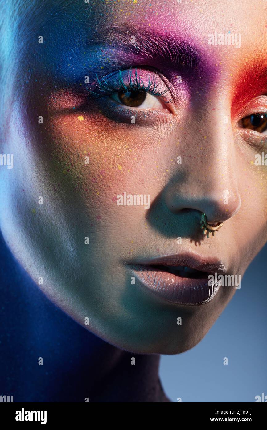 Colour outside the lines. Studio shot of a young woman posing with ...