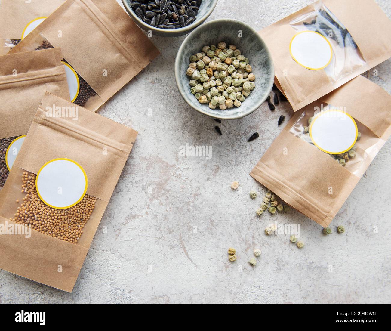 Microgreen seeds in paper bags and microgreen sowing equipment on the ...
