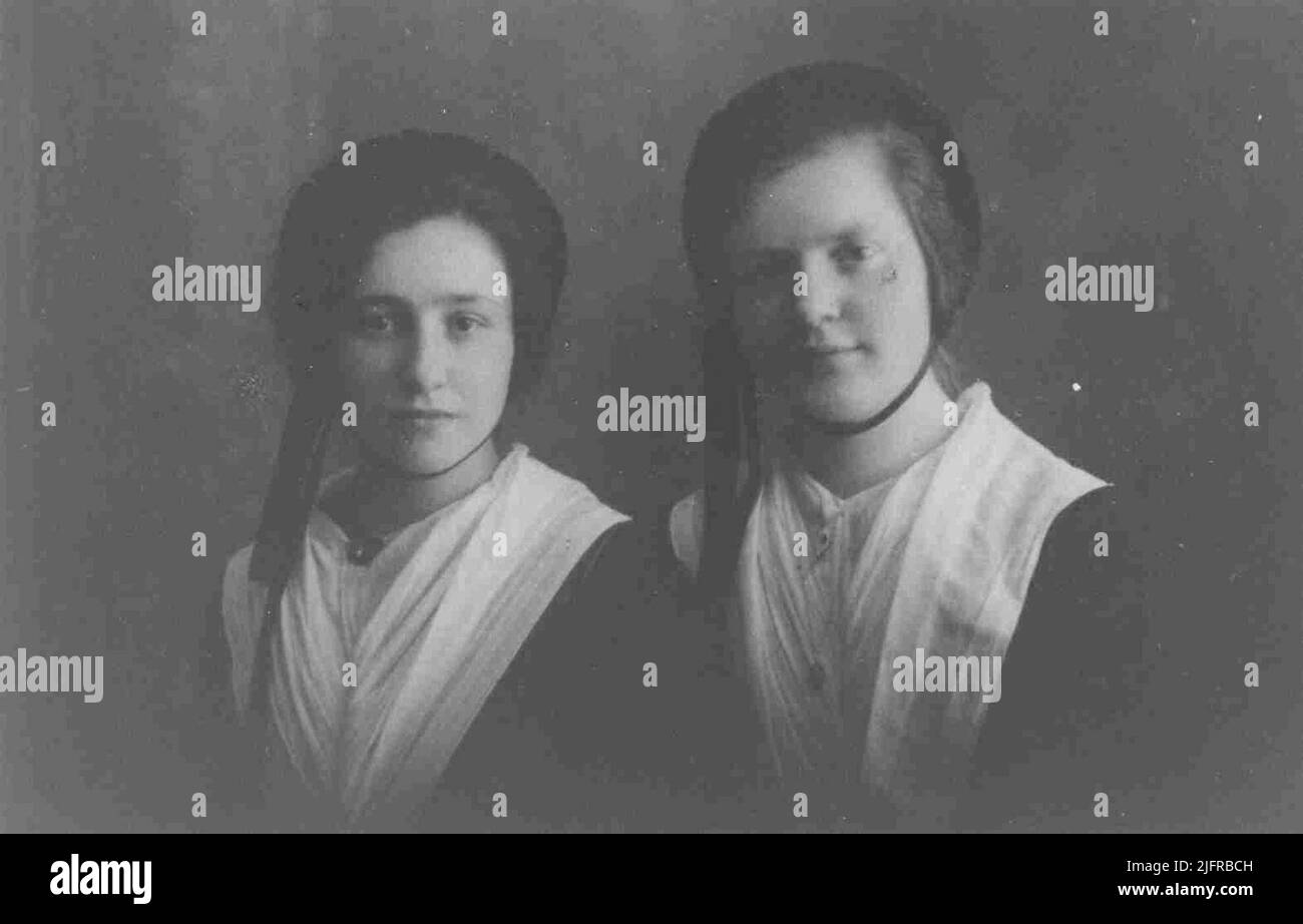 Two orphan girls in the uniform of Catholic Orphanage Stock Photo - Alamy