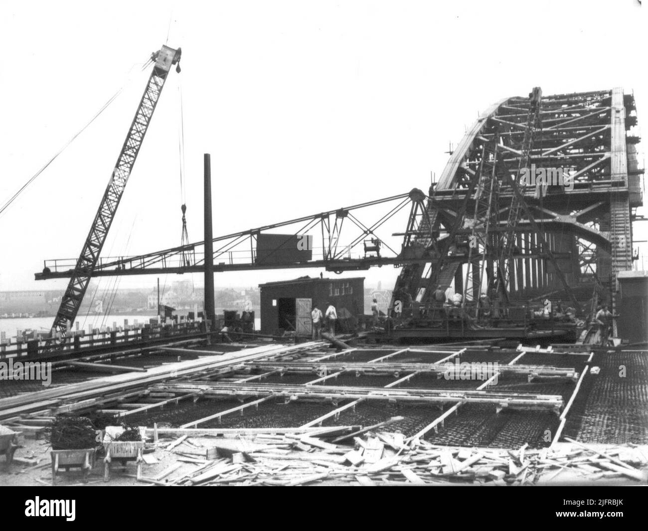 Laying the road surface on the bridge Stock Photo - Alamy