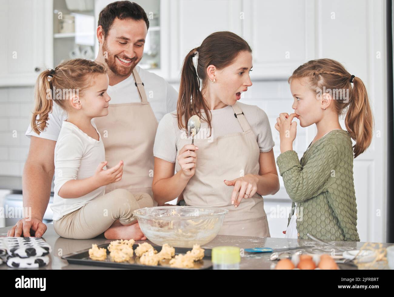 Baking done with care is an act of love. Shot of a family baking ...