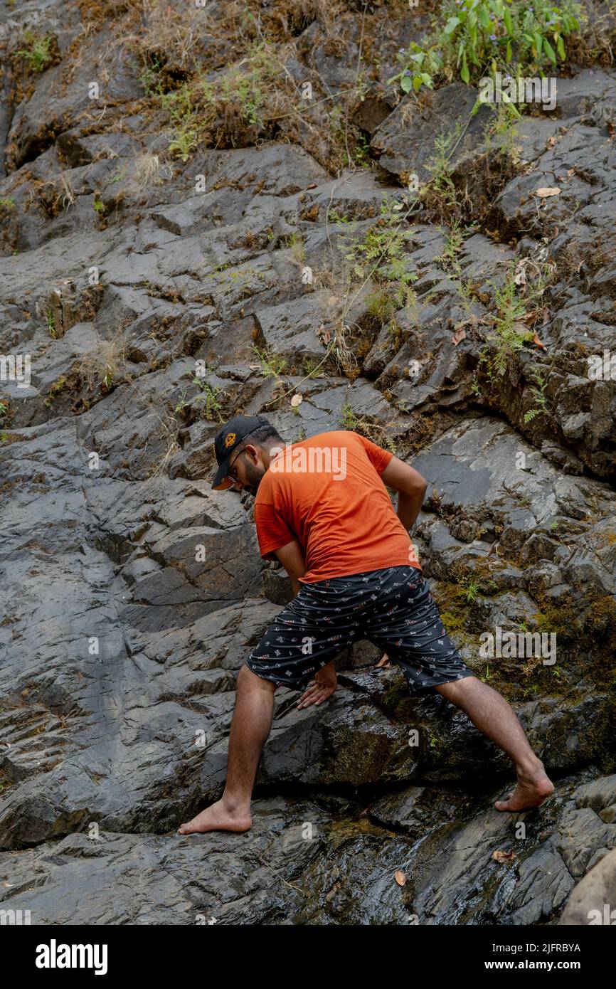 Gokarna,Karnataka, India - April 02,2022: Young Indian man climbing ...