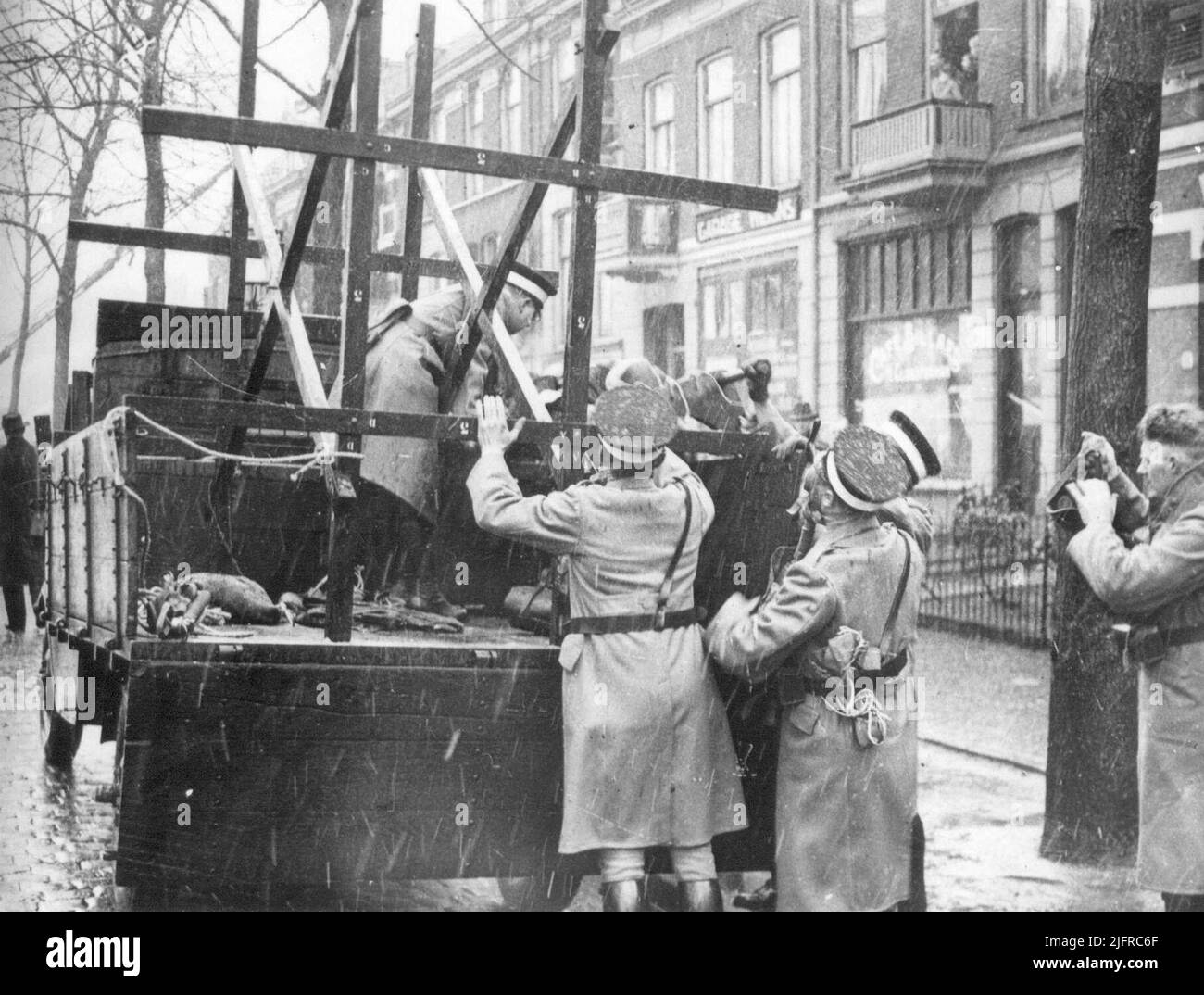 Unloading goods by Dutch soldiers Stock Photo - Alamy