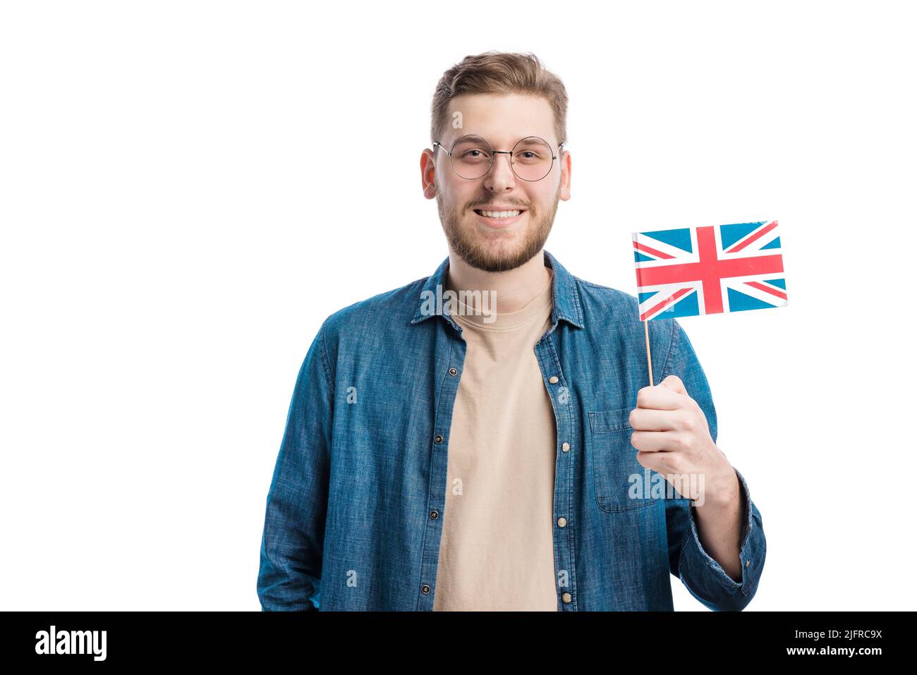 Patriotic man holding UK flag Stock Photo - Alamy