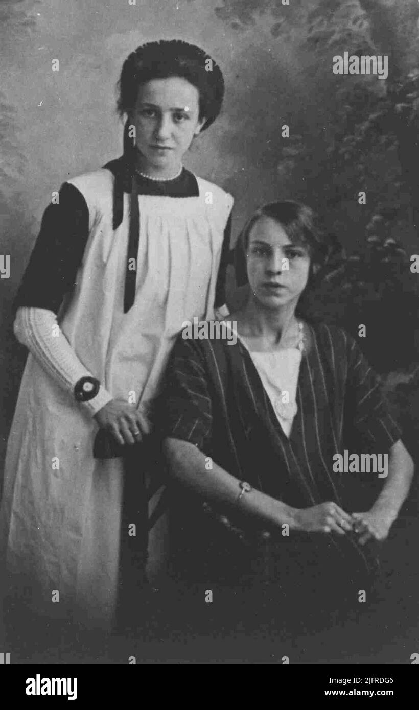 Two orphan girls, one in uniform, from the Catholic Orphanage Stock ...