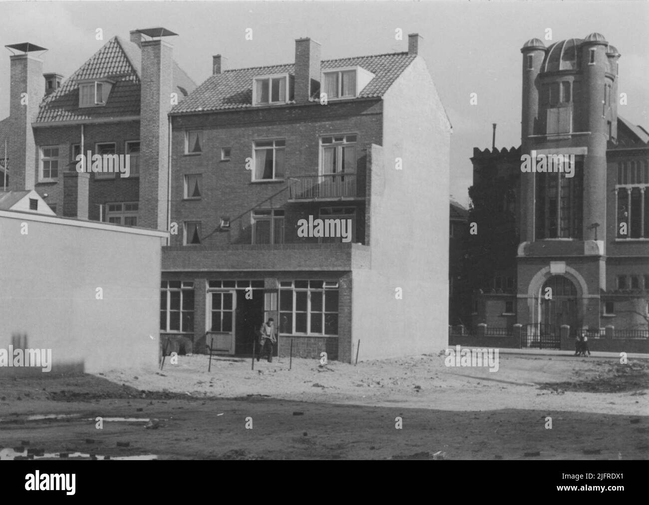 The back of some new -build homes. Right in the background the ...