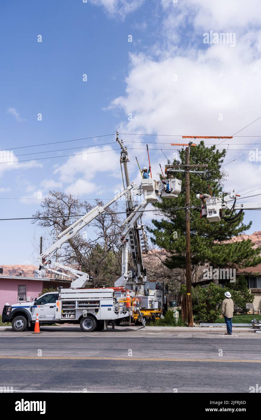Electrical workers make perform maintenance on live electrical ...