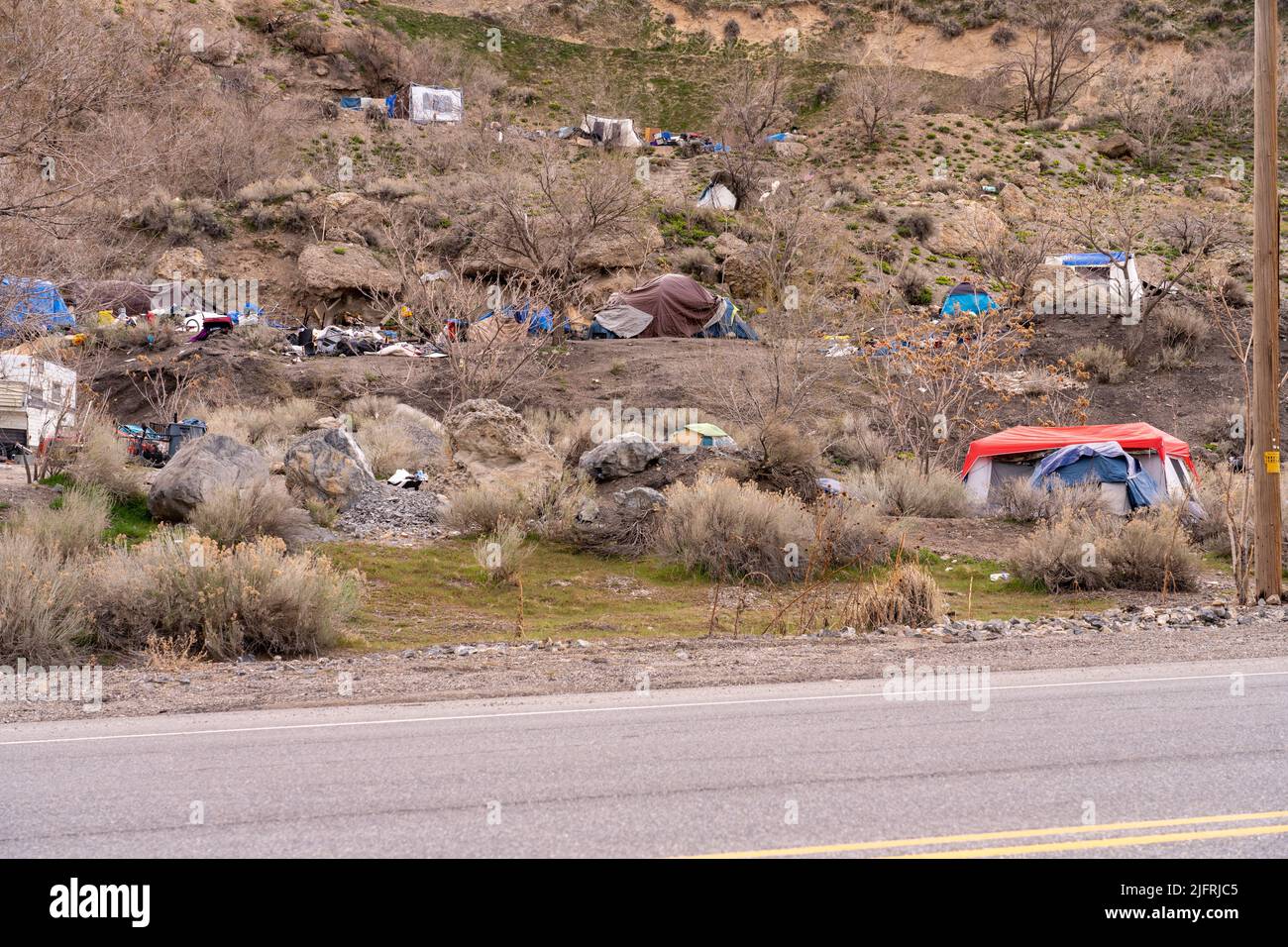 Tents in a camp of homeless people along a highway in Utah Stock Photo ...