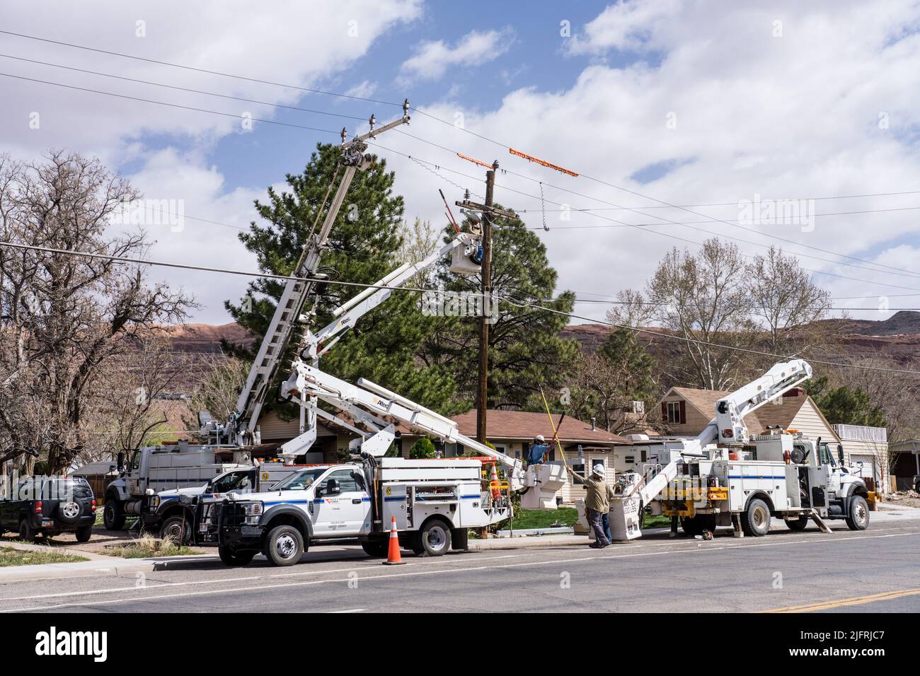 Electrical workers make perform maintenance on live electrical ...
