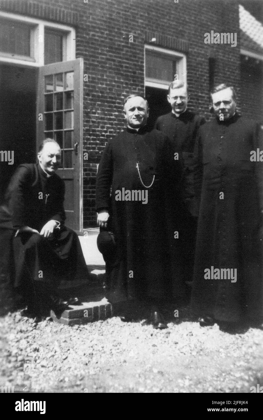 Four clergymen of the Lourdeskerk Stock Photo - Alamy
