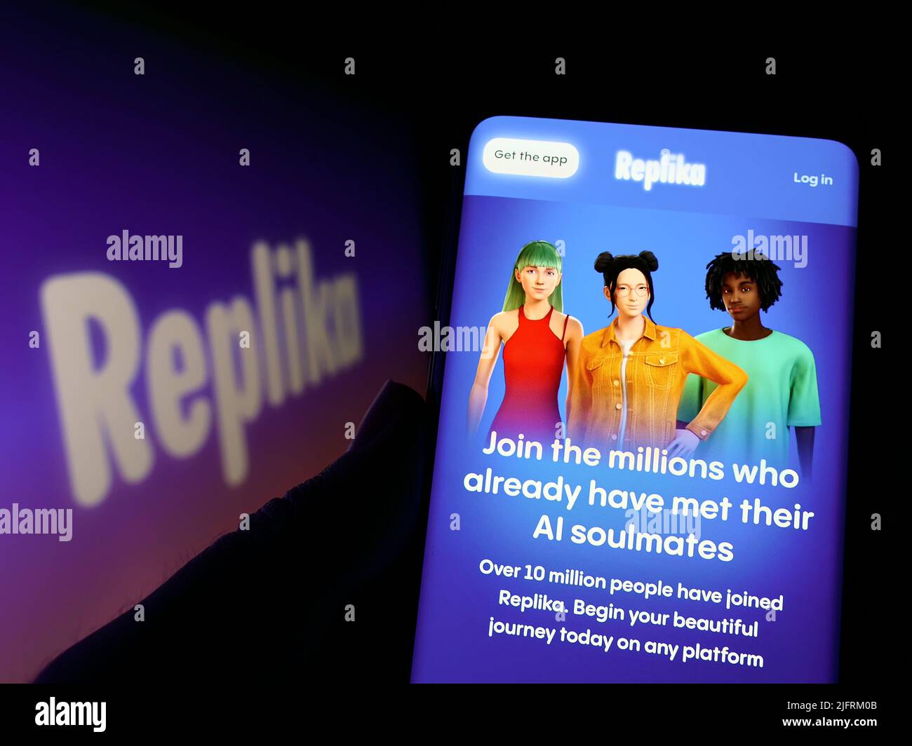 Person holding cellphone with webpage of US software company Luka Inc ...