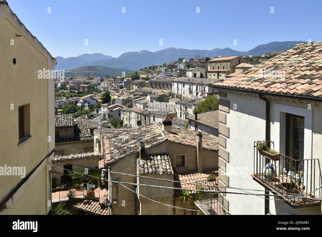 A bird's eye view of the old houses and buildings of Altomonte village ...