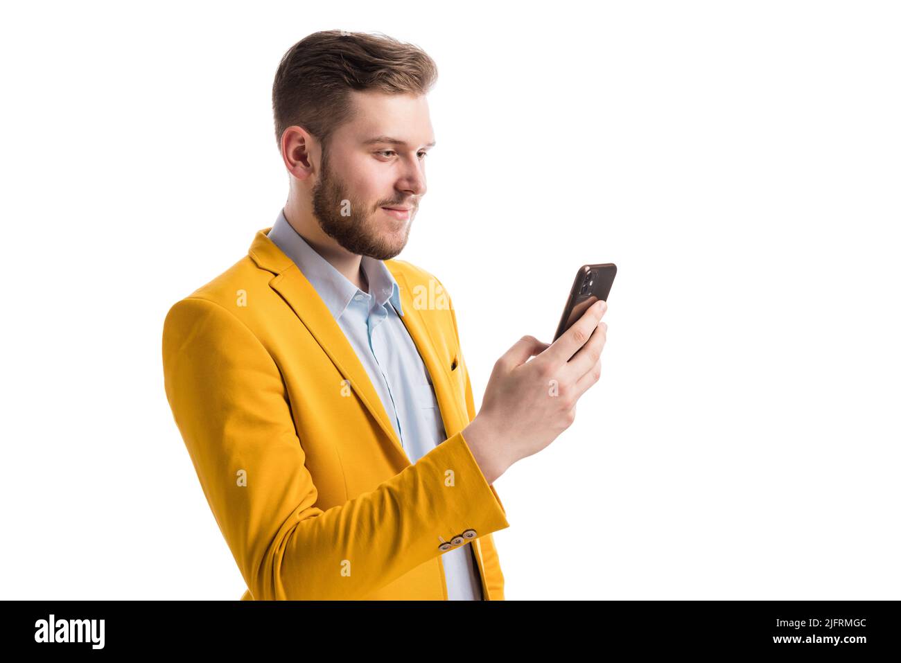 Focused successful male holding smartphone Stock Photo - Alamy