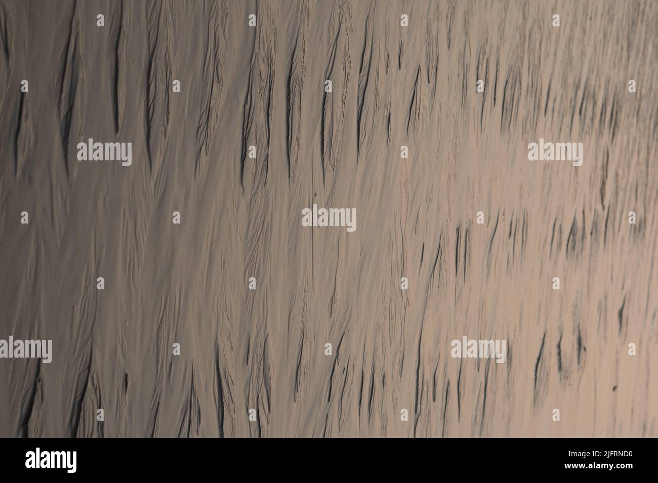 beautiful view of wet sand and sharp patterns with golden light Stock ...