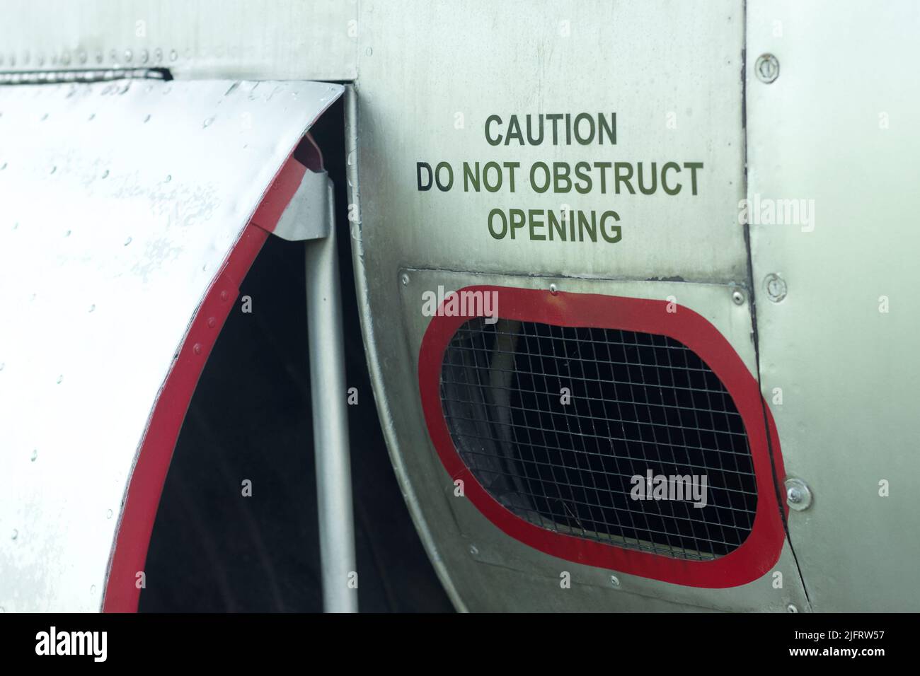 Caution do not obstruct opening decal on an old aircraft Stock Photo ...