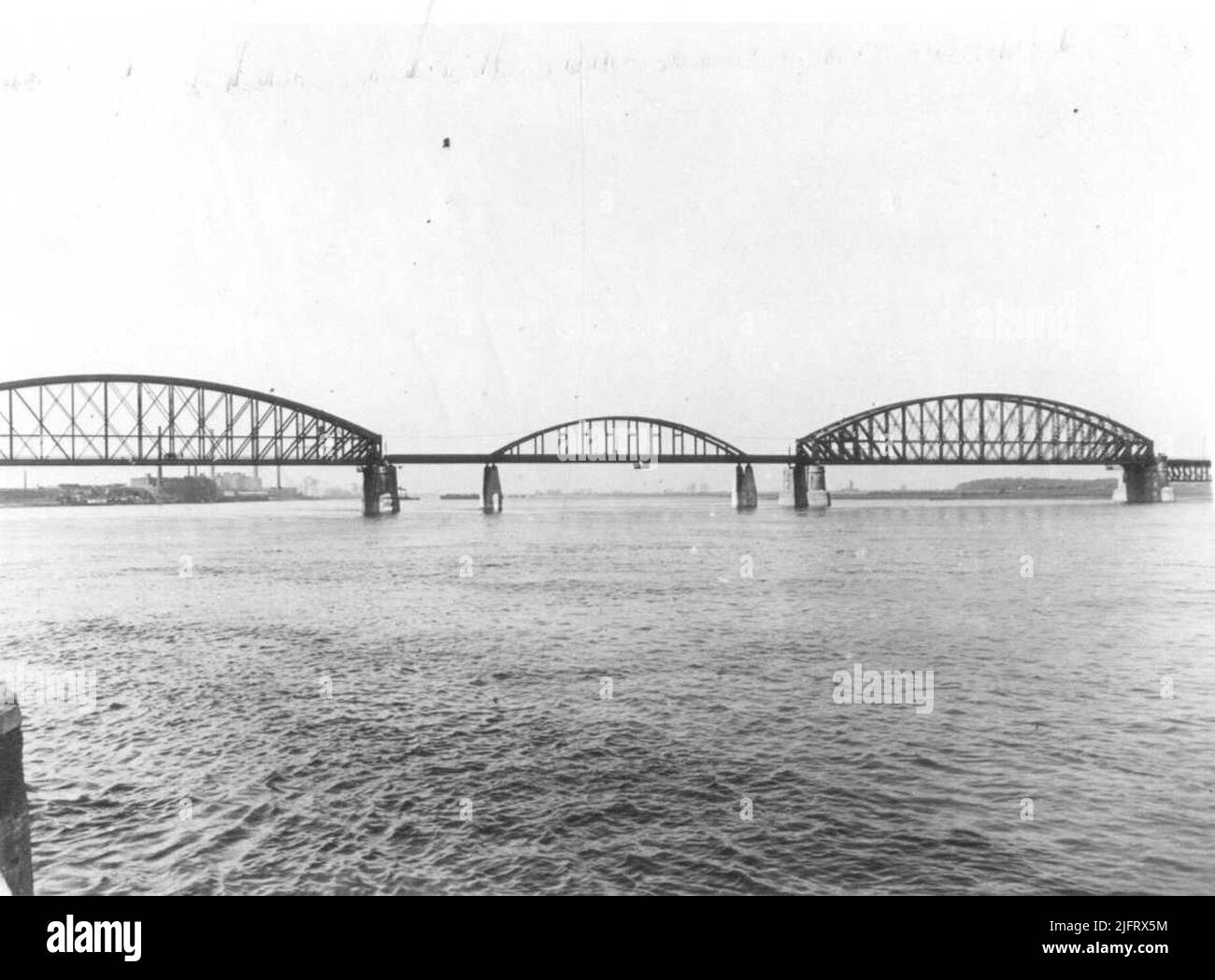 The railway bridge with the middle segment destroyed by its own troops ...
