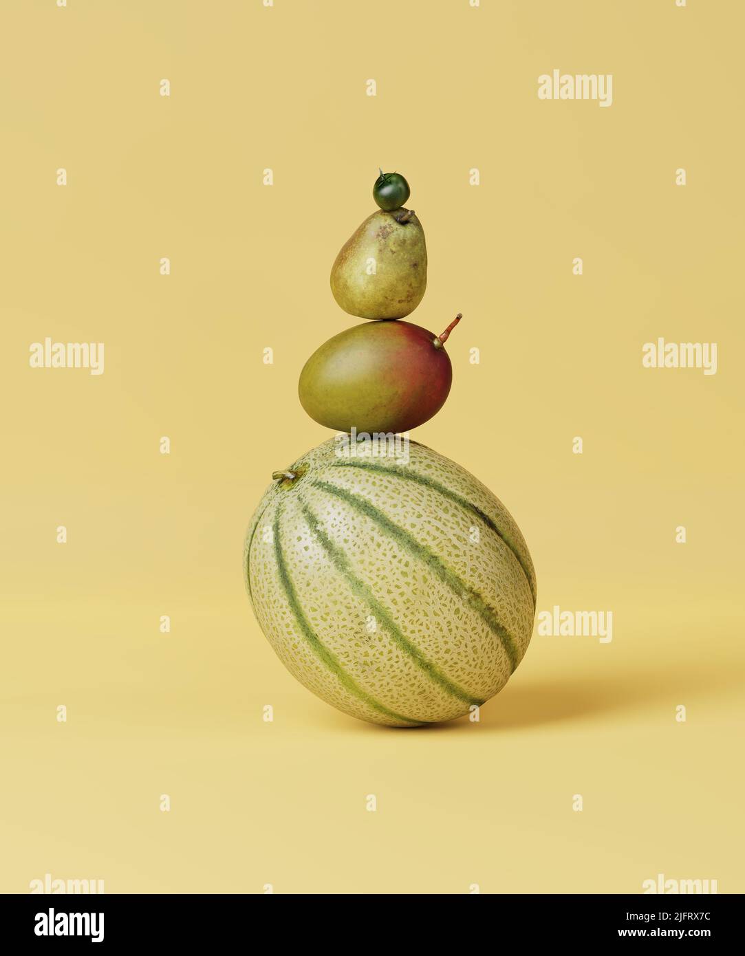 Still life pyramid of melon, pear, mango and tomato on a yellow ...