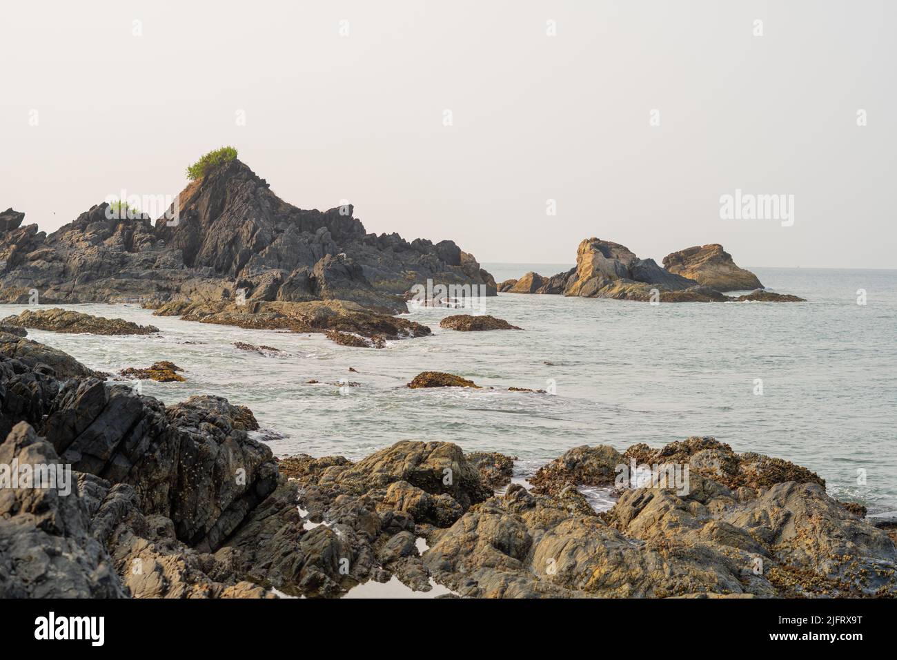 Attractive blue waves crashing rocks hi-res stock photography and ...