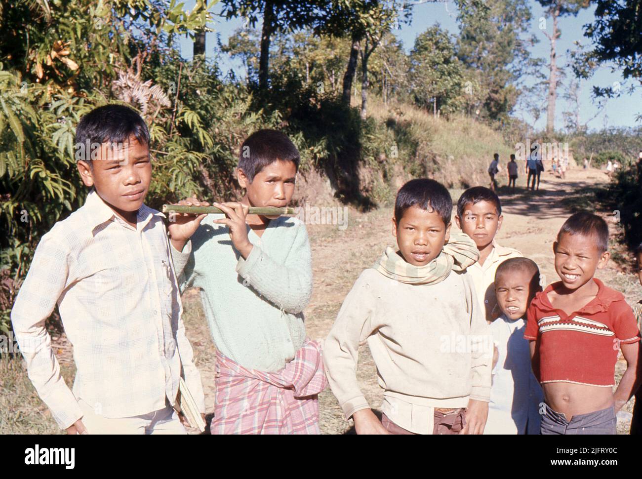 Sumatra, circa.1970. A group of young boys near Lake Toba. One boy is ...