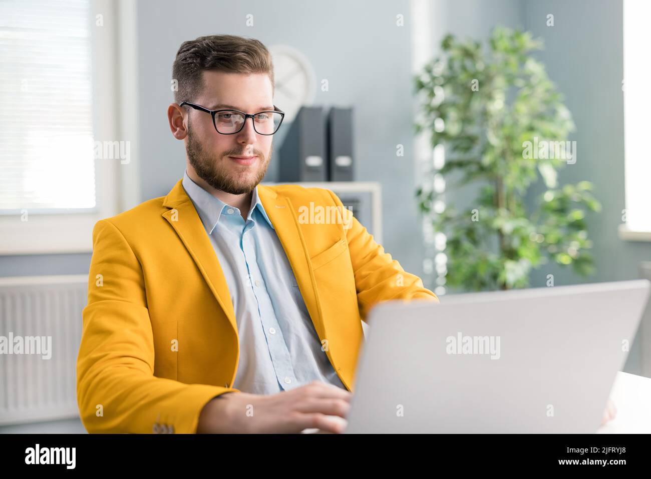 Serious handsome man working laptop hi-res stock photography and images ...