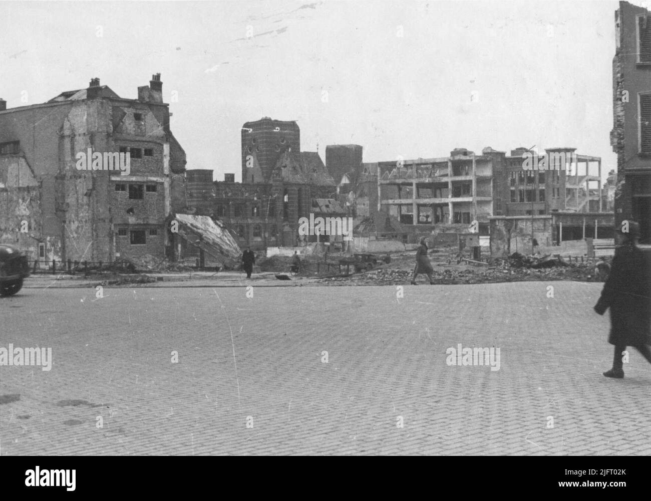 Destroyed buildings seen from the Ziekerstraat, on the left the ...
