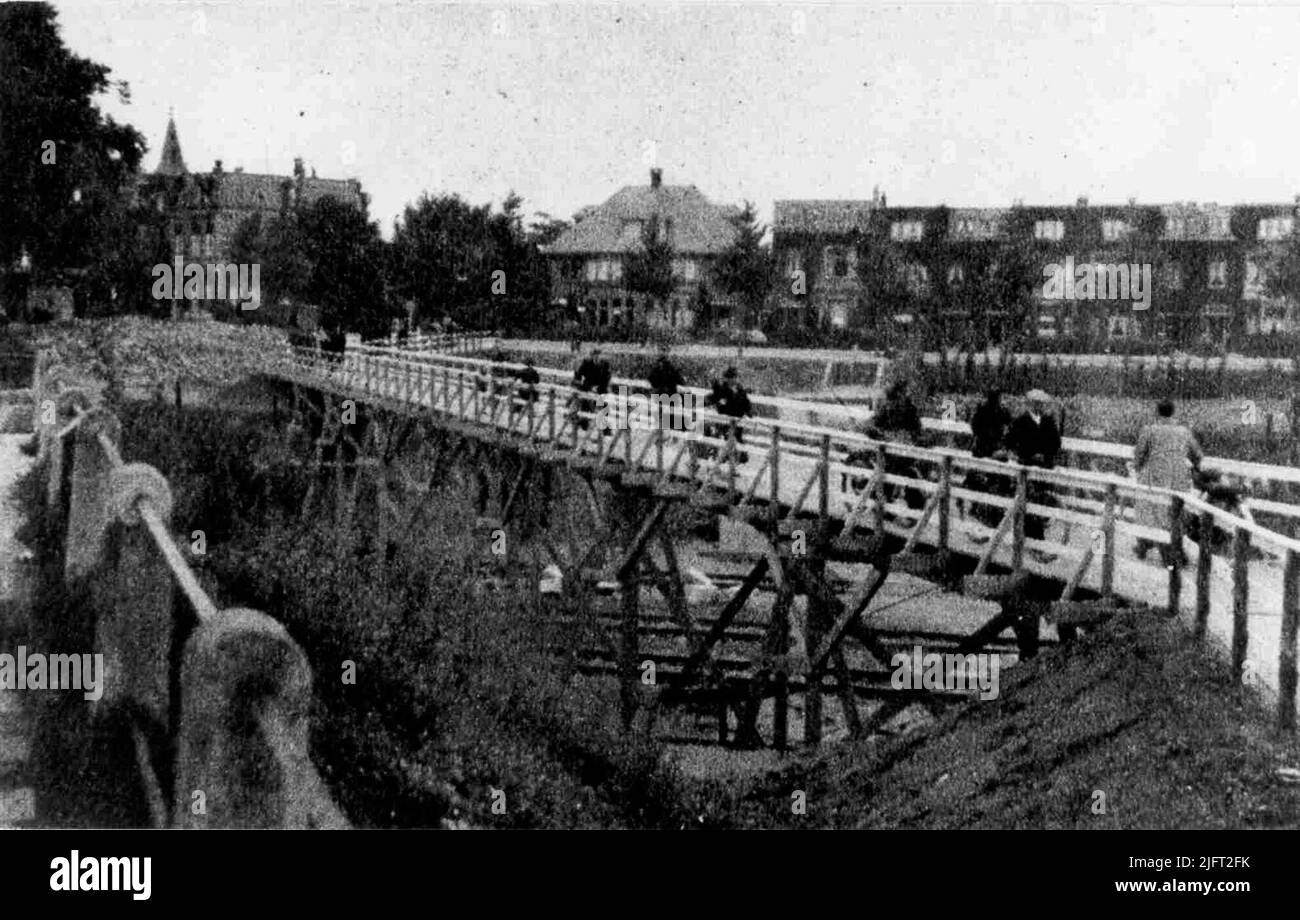 The wooden emergency bridge for pedestrians and bicycles over the ...