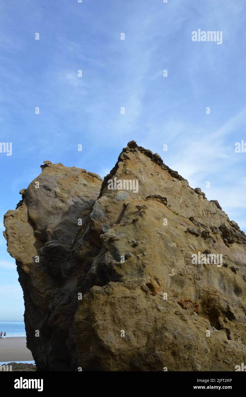 A spiked rock in the blue sky Stock Photo - Alamy