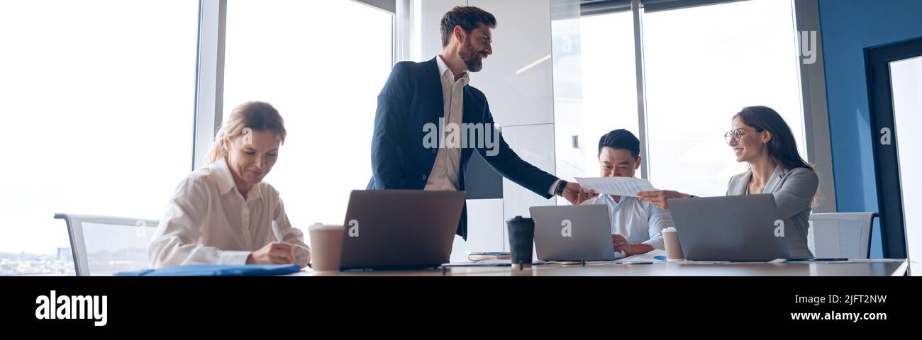 Creative business team working on new project in modern office with ...