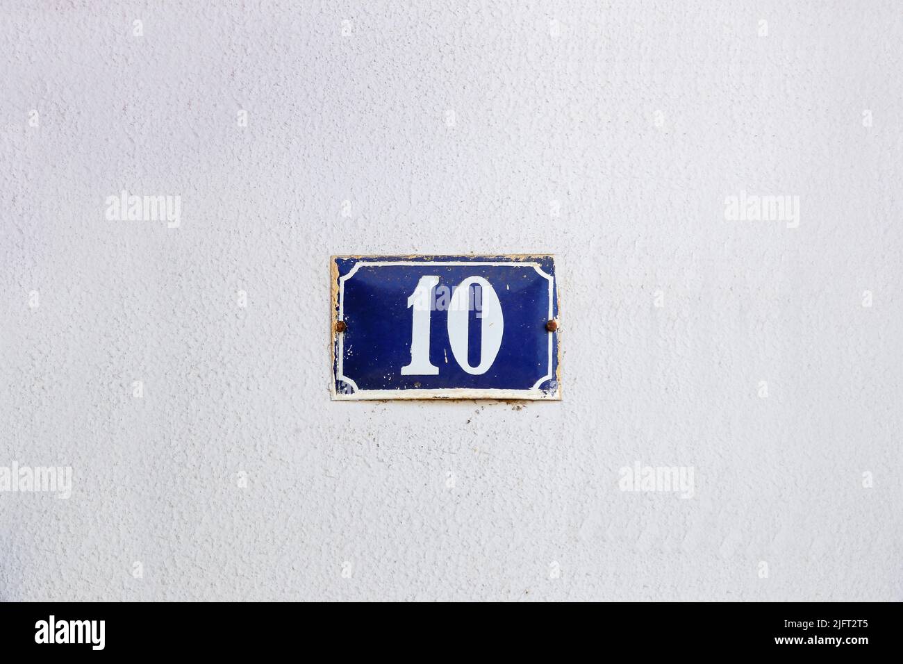 number ten in metallic plate format, with copy space and blue and white ...