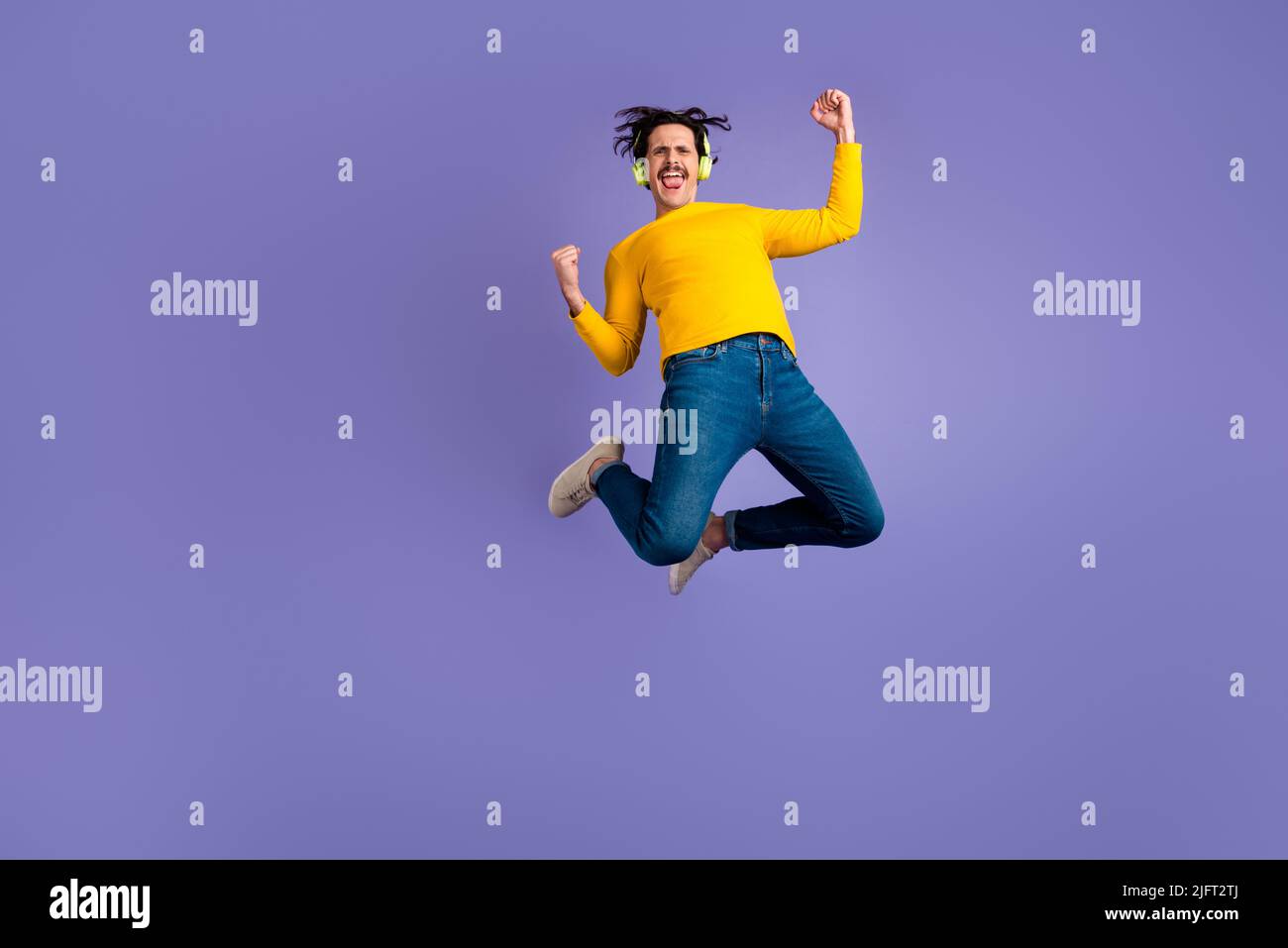Full body of energetic overjoyed guy jumping raise fists shout yes ...