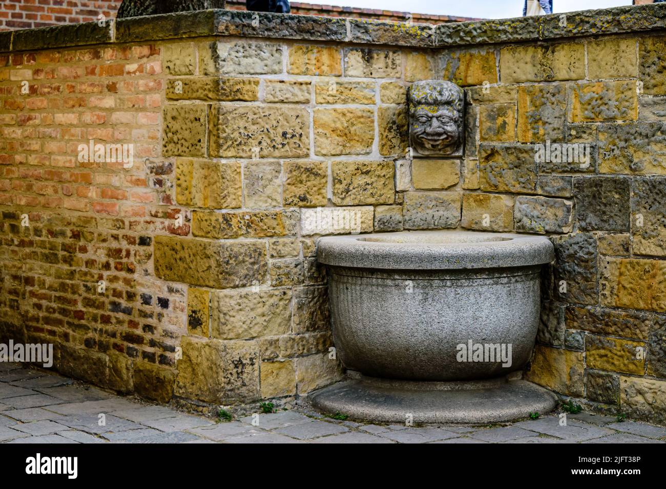 A sculpture of a human head on a water tank at the Spilberk Castle in ...