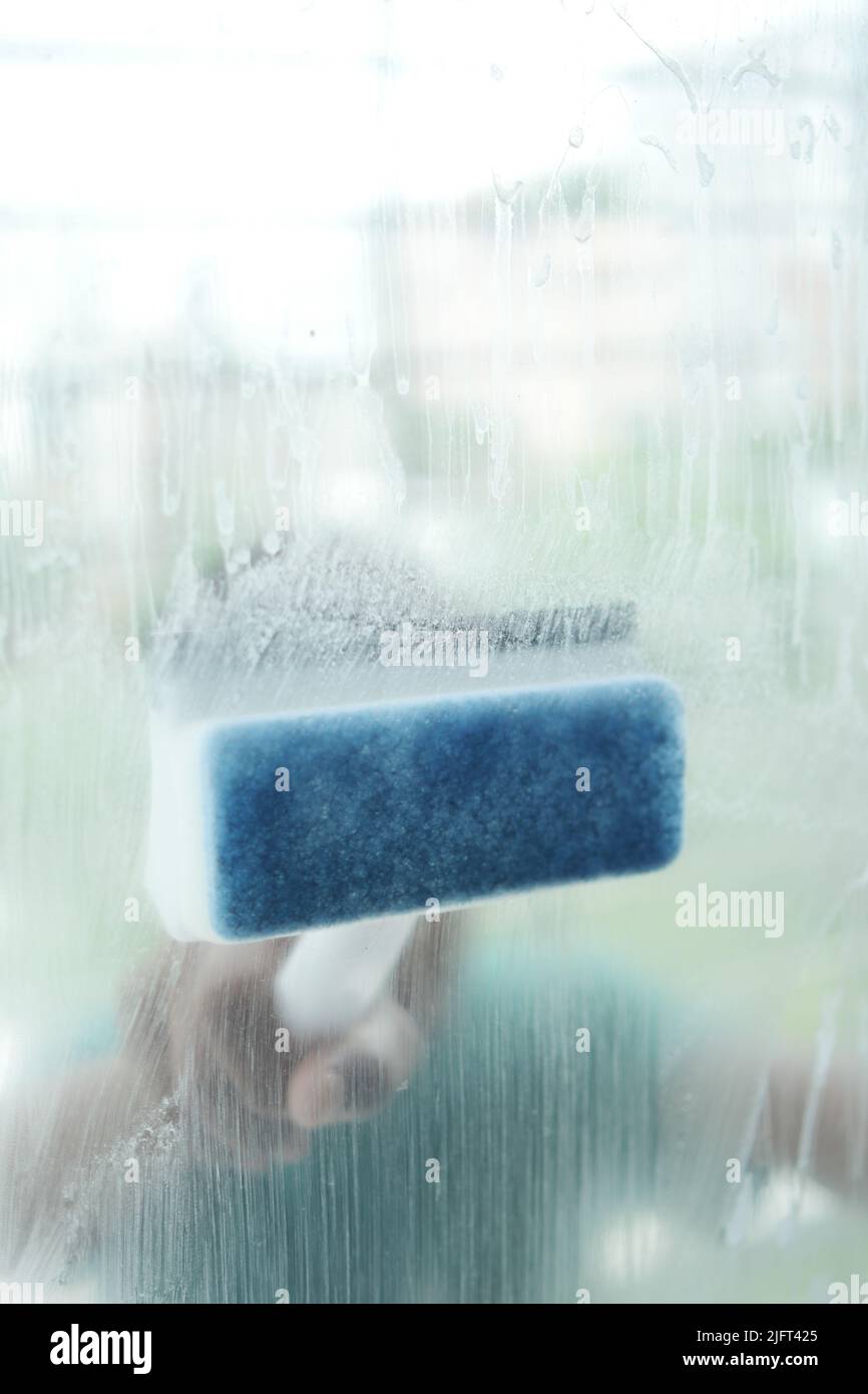 Close up of man hand cleaning window glass Stock Photo - Alamy