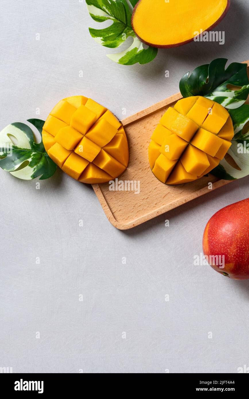 Mango background design concept. Top view of diced fresh mango fruit ...