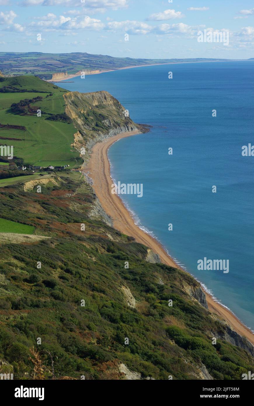 An aerial view of Golden Cap mountain peak on the sea shore in England ...